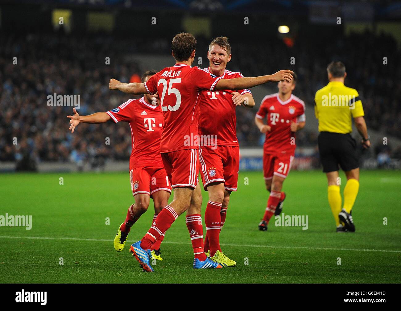 Bayern Munich's Thomas Muller (left) celebrates scoring his side's ...