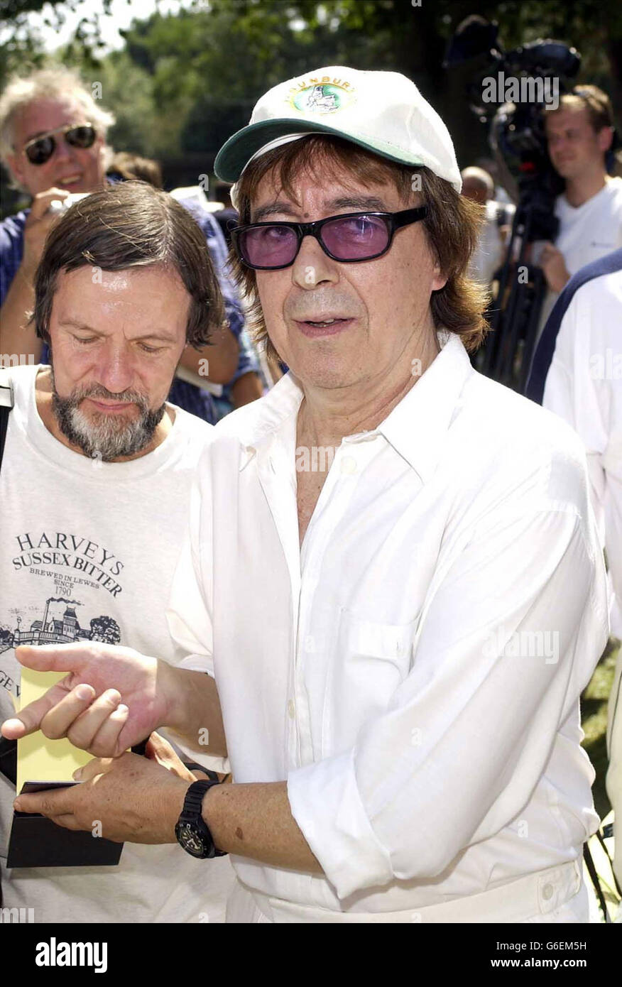 Former Rolling Stones guitarist Bill Wyman arrives to join Eric Clapton ...