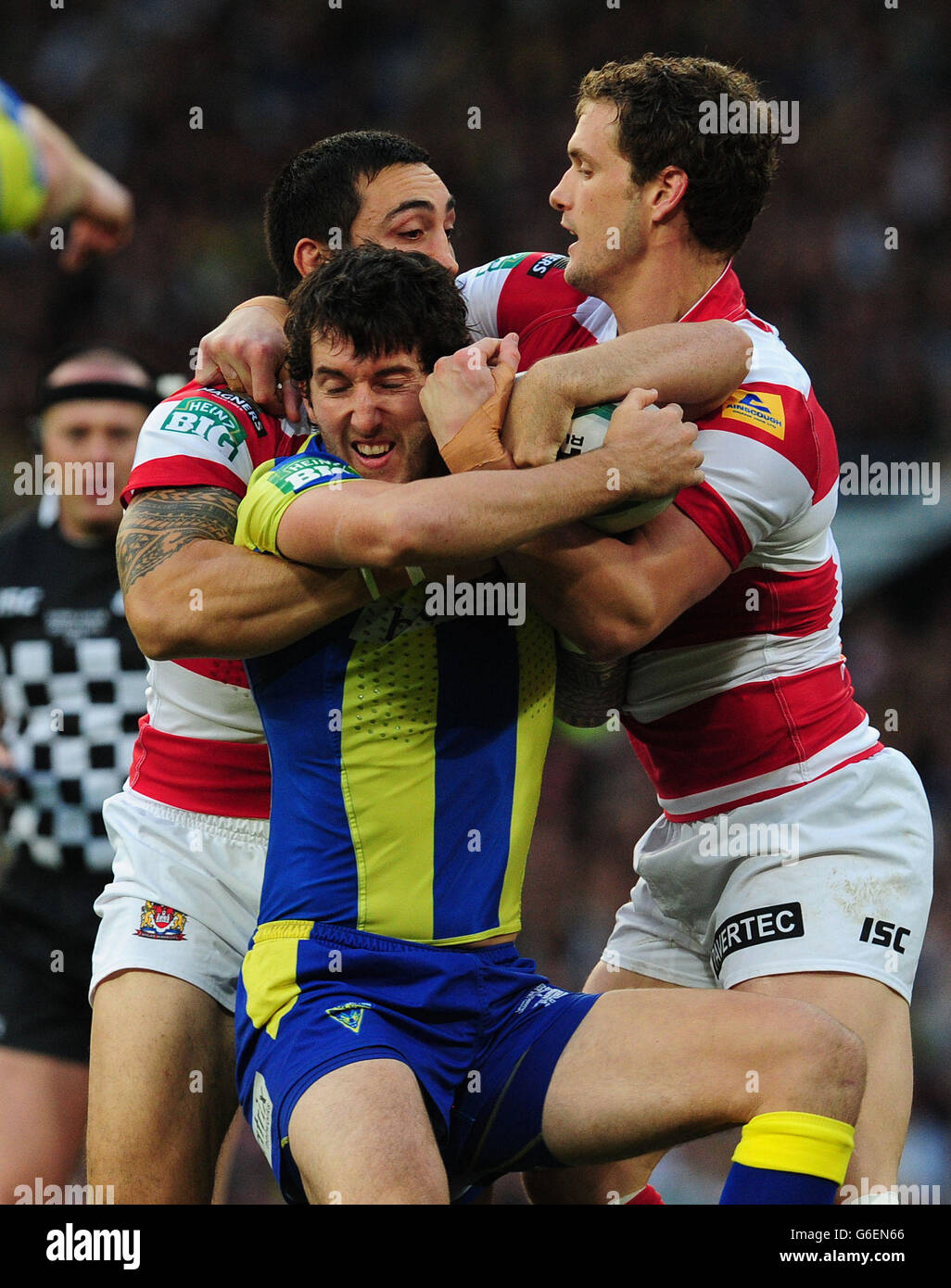 Warrington Wolves Stefan Ratchford is tackled by Wigan Warriors ...