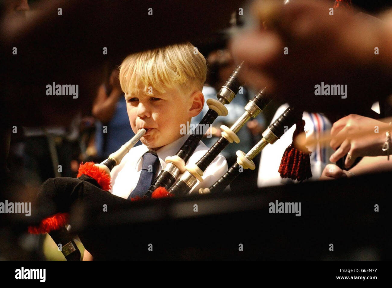 A young piper at the World Pipe Band Championships, which features over ...