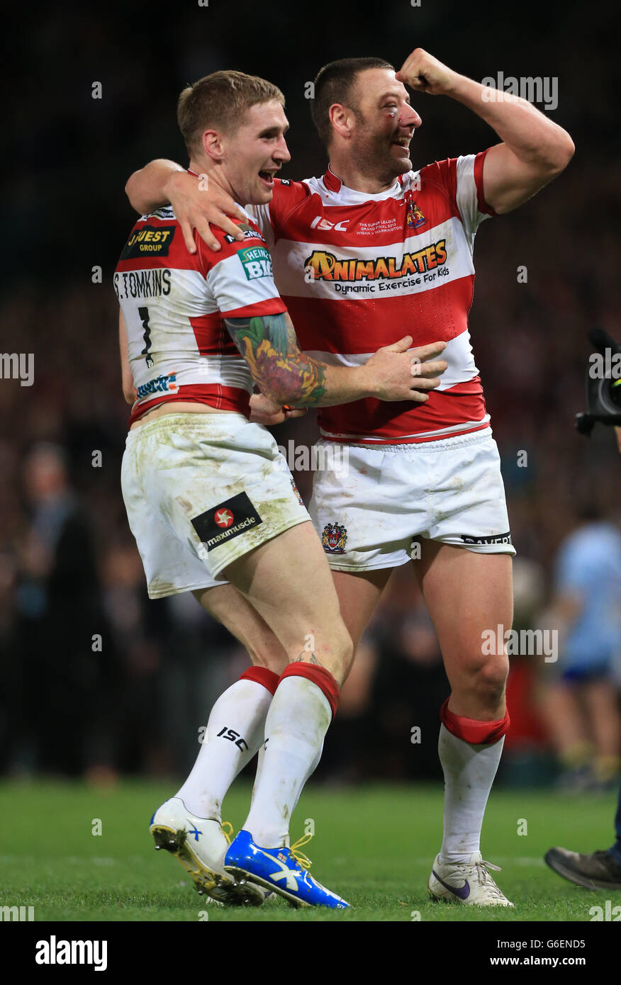 Wigan warriors sam tompkins celebrates victory with blake green hi-res ...
