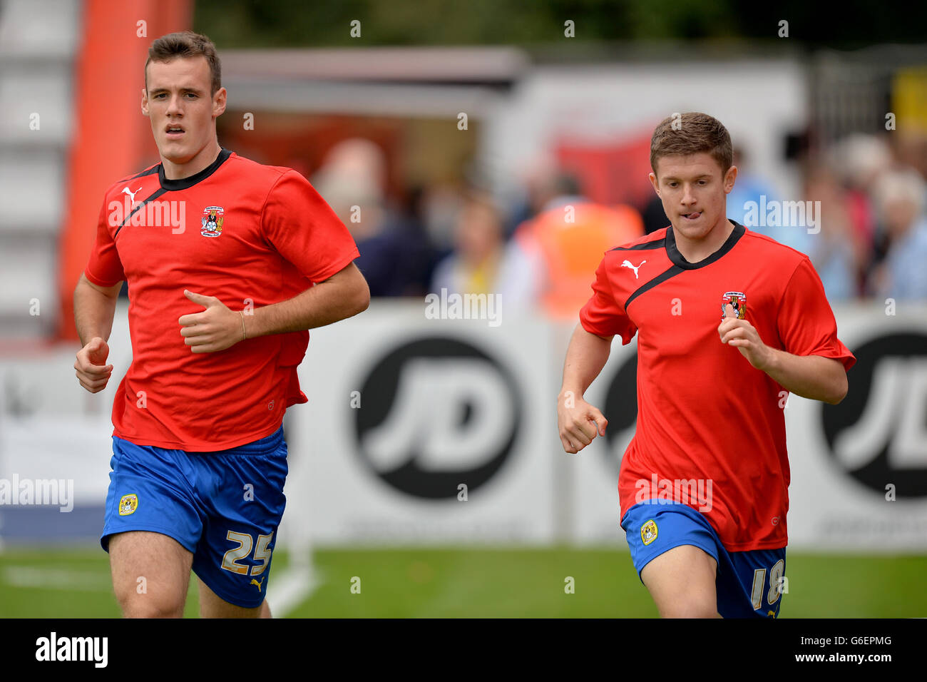 Coventry citys aaron phillips right during the warm up hi-res stock ...