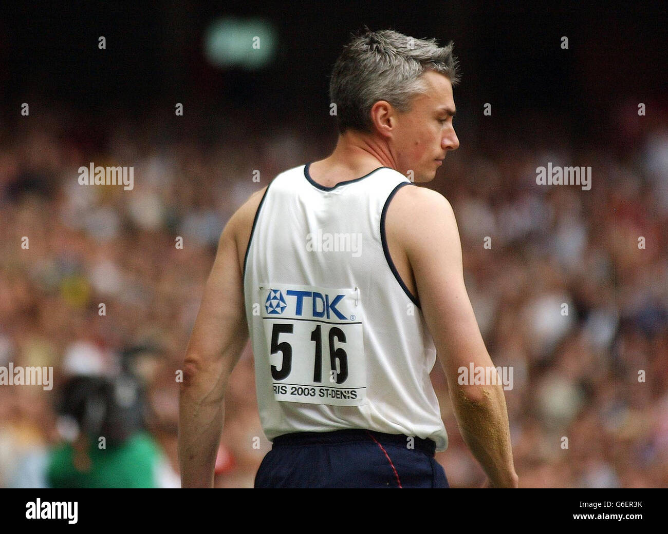 Jonathan Edwards checks pit after jump. Jonathan Edwards looks back at ...