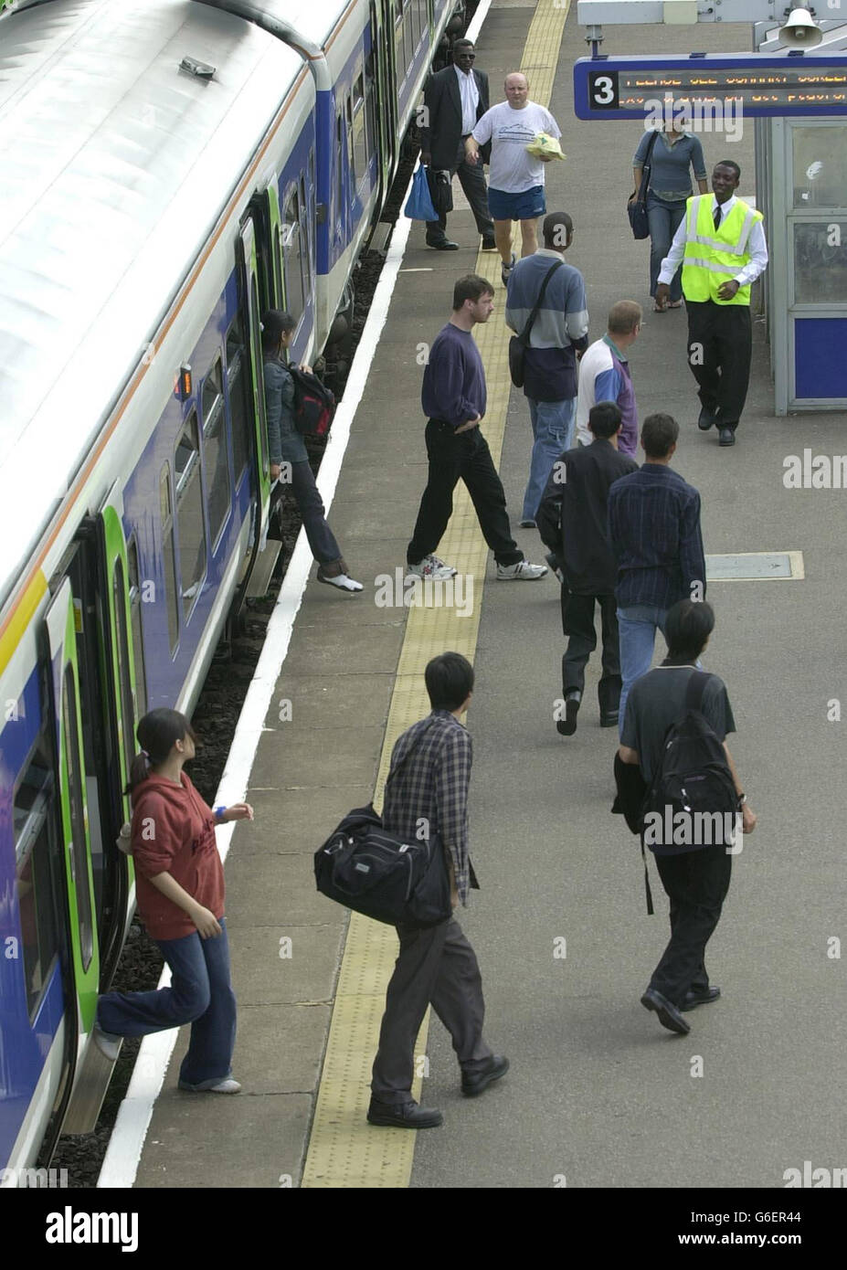 Passengers disembark a train from London at Langley Railway Station ...