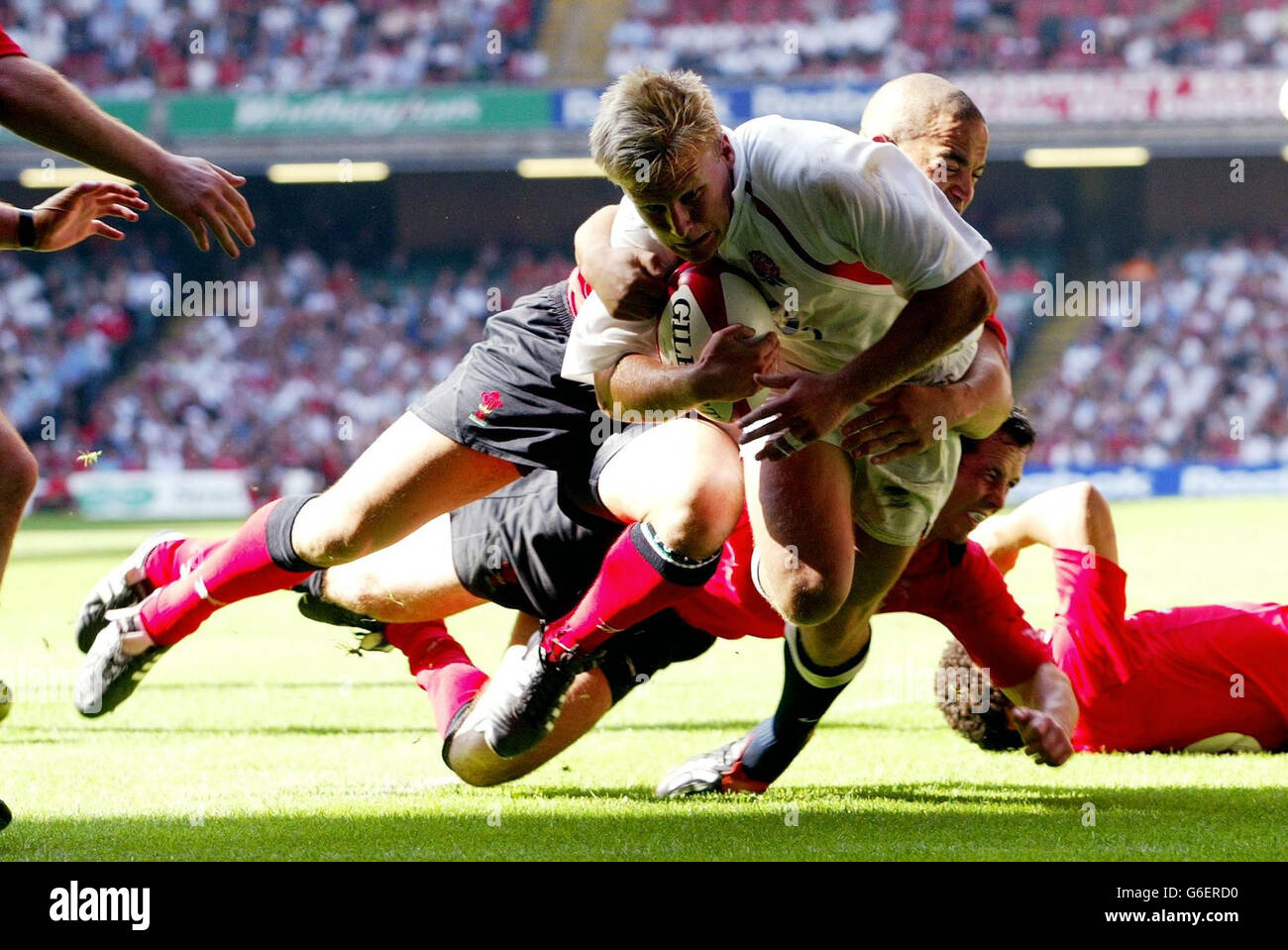 England's Stuart Abbott goes past the Wales defence to score the fourth ...
