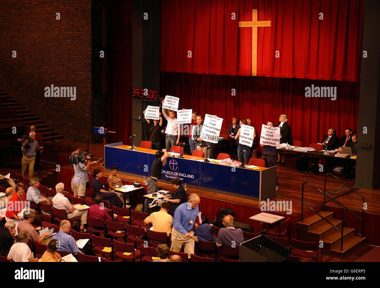 Church of England General Synod delegates leave the stage during the ...