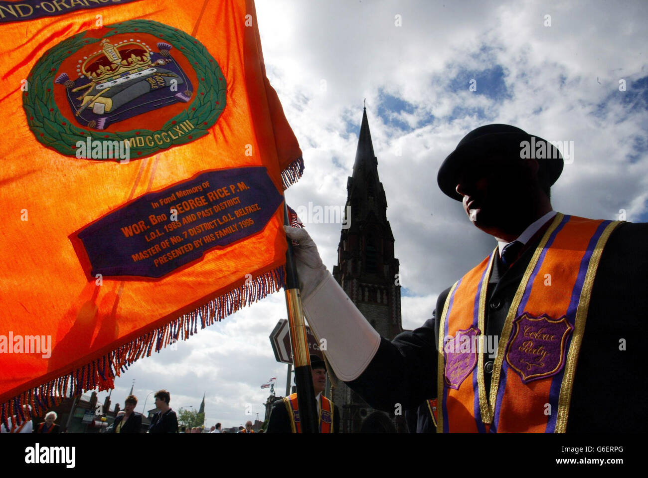 Orangeman Stephen Wright, carrying an Orange banner and wearing his ...