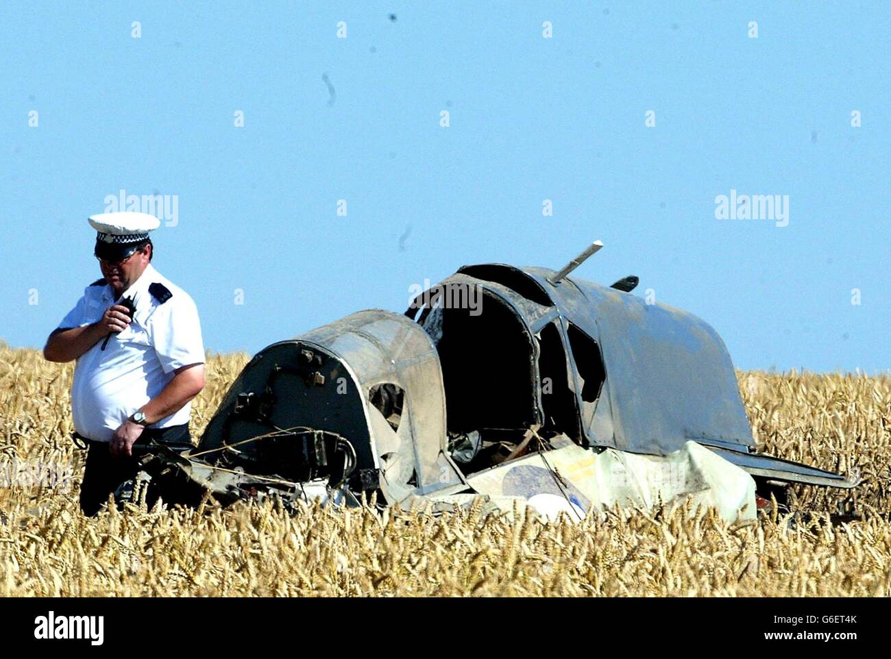 Emergency services at the scene of the plane crash, in a field near ...