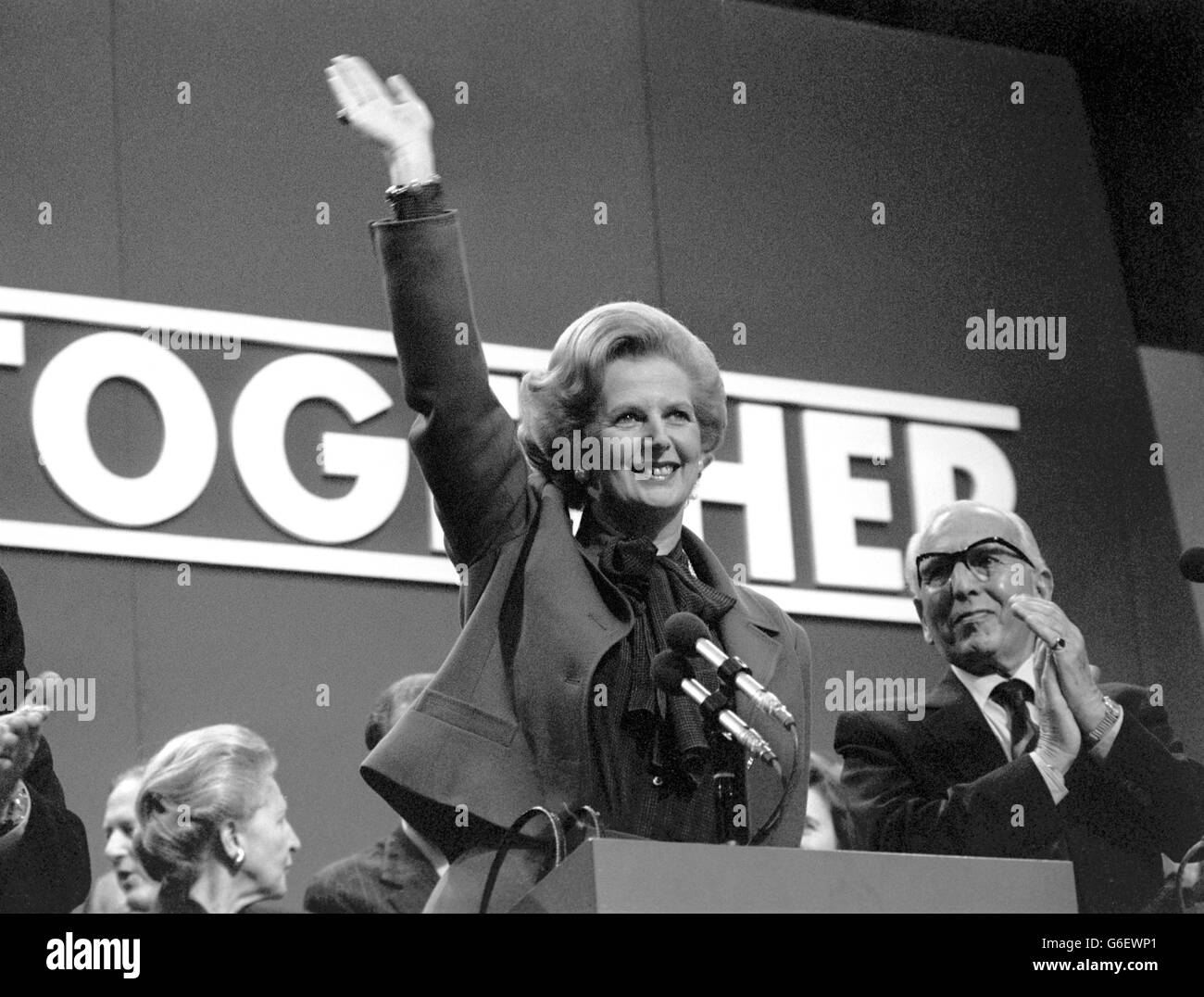 The Prime Minister Mrs Margaret Thatcher acknowledges a standing ...