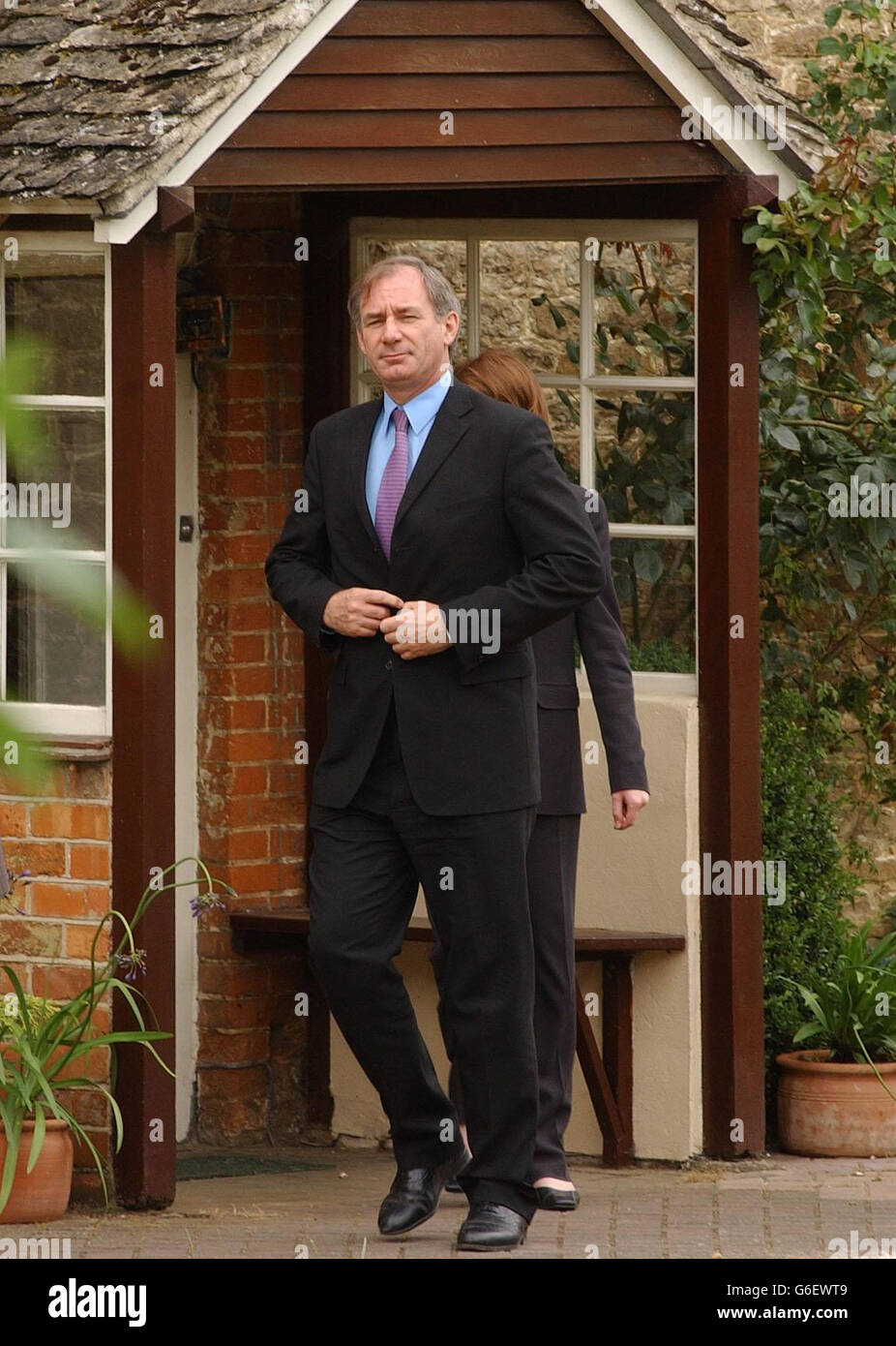 Defence Secretary Geoff Hoon leaves, after visiting Janice Kelly, the ...