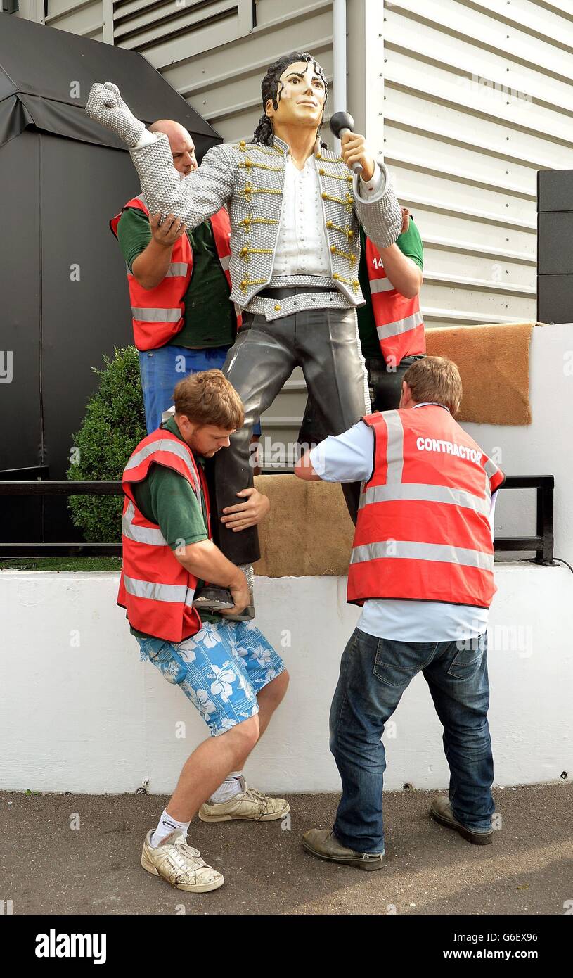 A group of stonemasons take down the statue of Michael Jackson that was ...