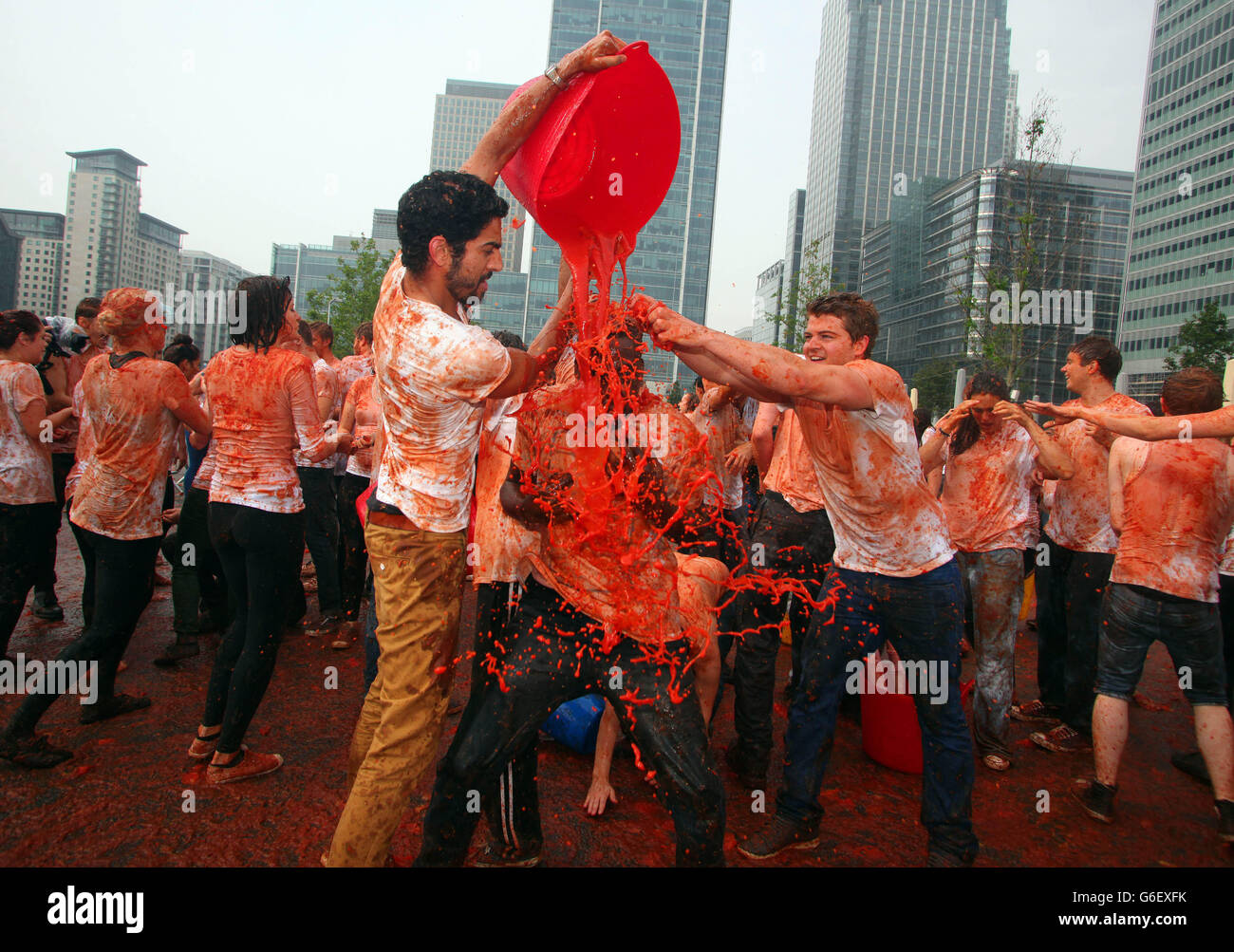People throw tomatoes during Mission Deli Wraps's re-creation of the ...