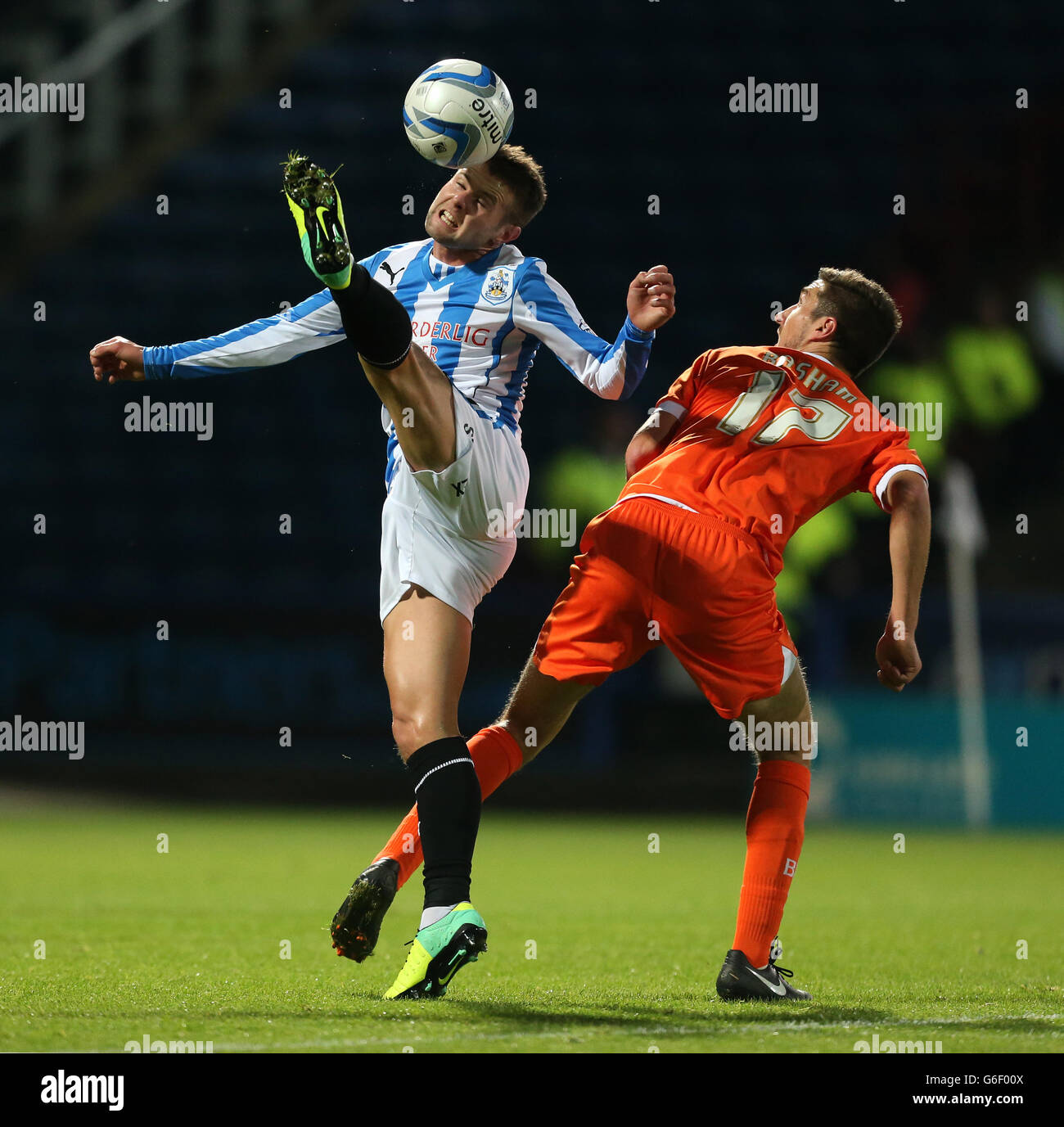 Huddersfield Town's Oliver Norwood and Blackpool's Chris Basham battle ...
