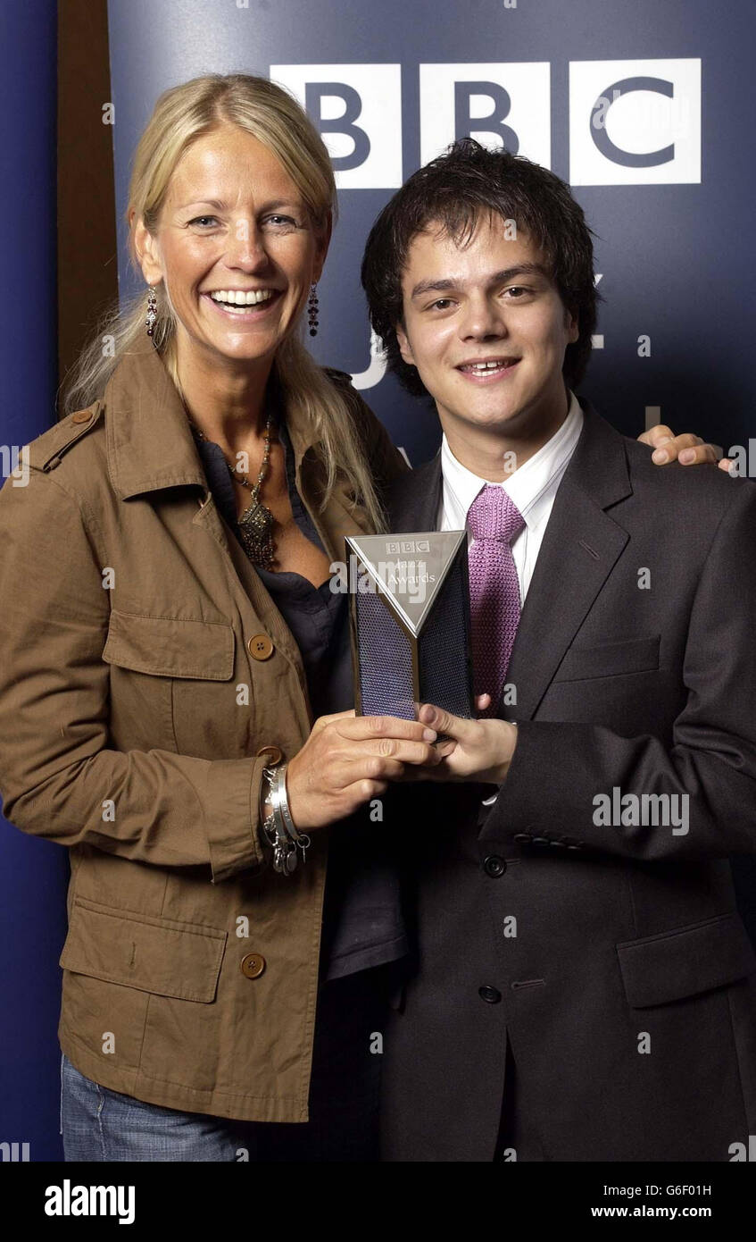 Singer Jamie Cullum poses with Ulrika Jonsson after he received the ...