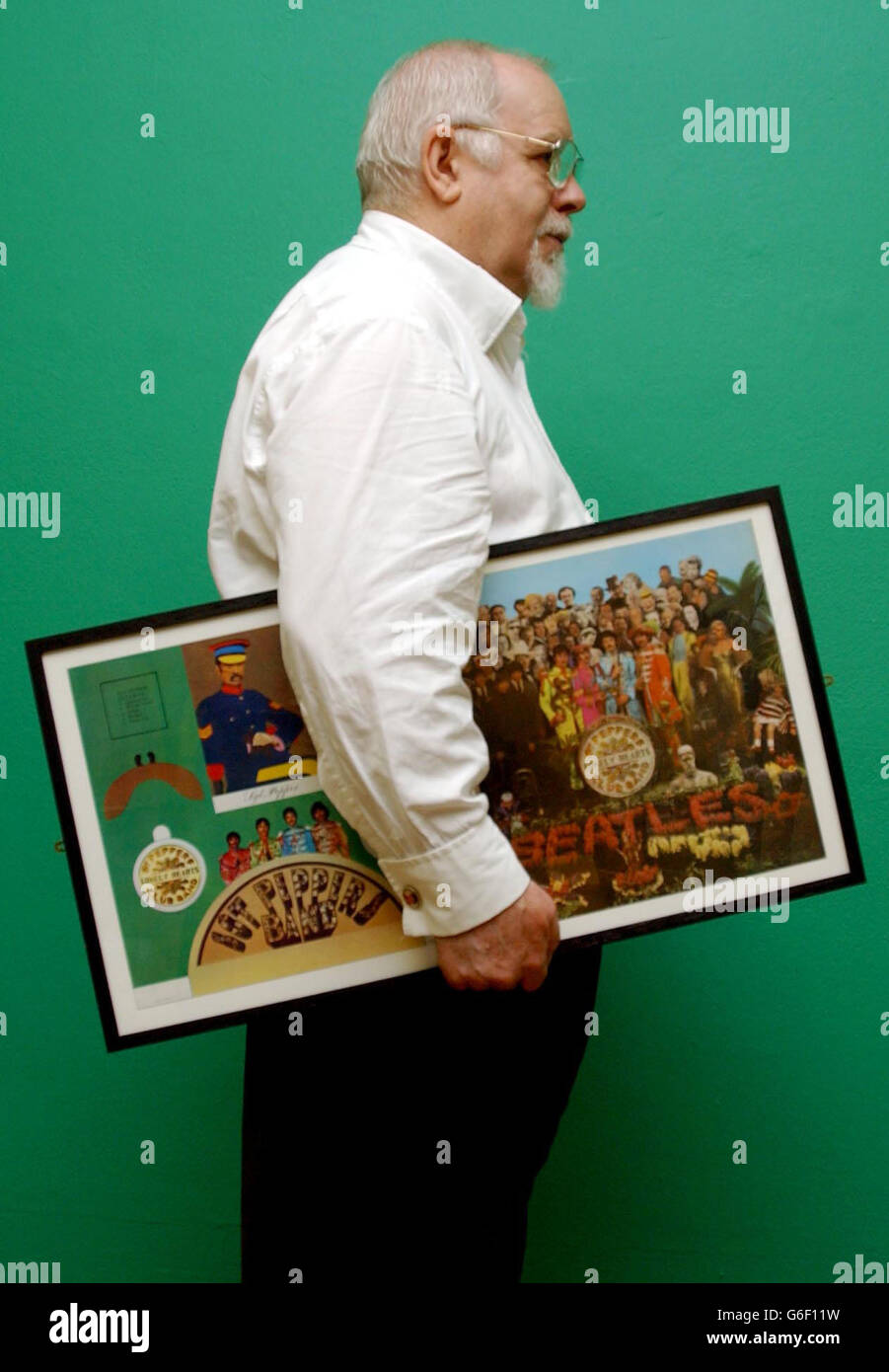 Pop artist Sir Peter Blake carries his most famous commercial piece ...