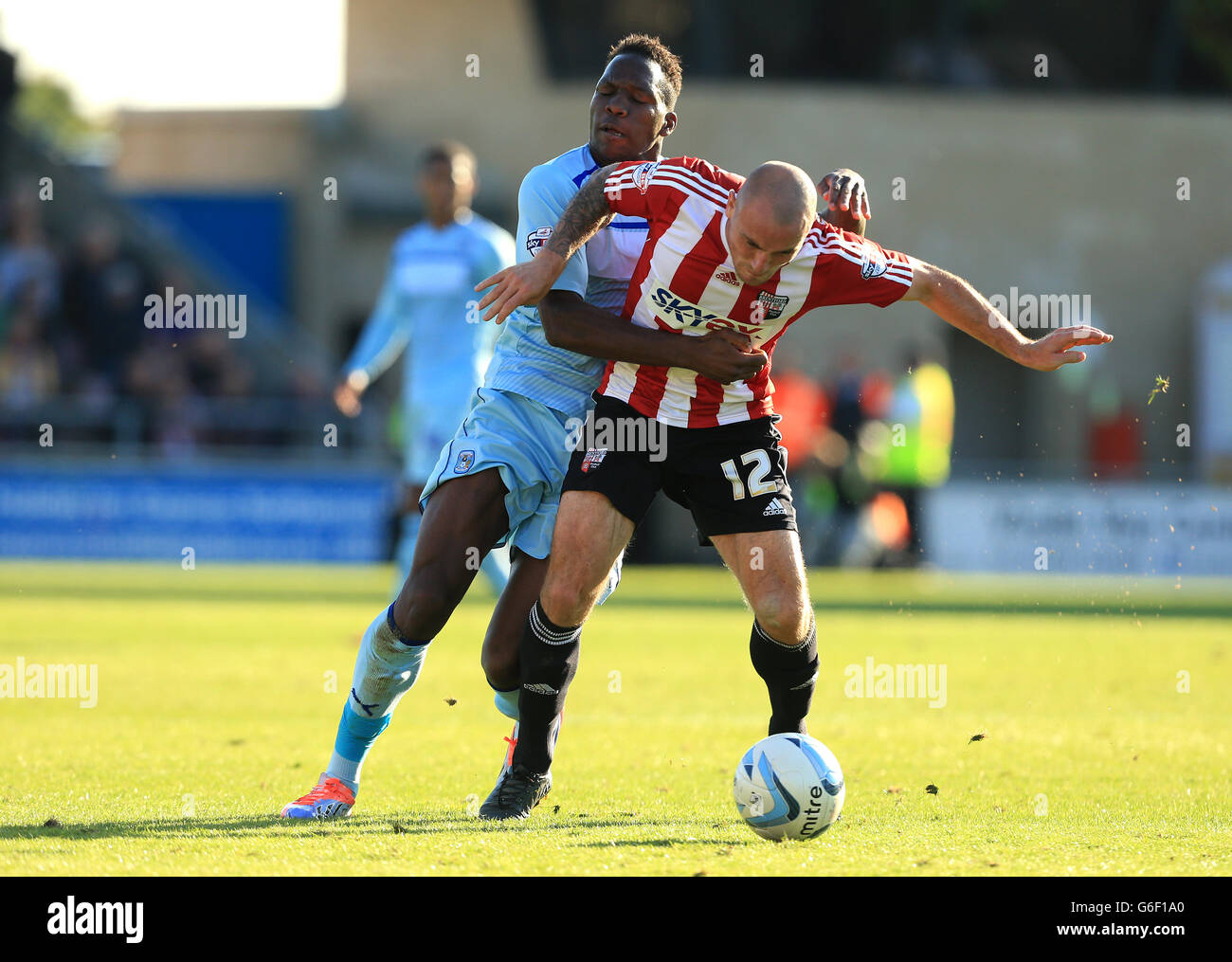 Coventry City's Mathieu Manset (left) and Brentford's Alan McCormack ...