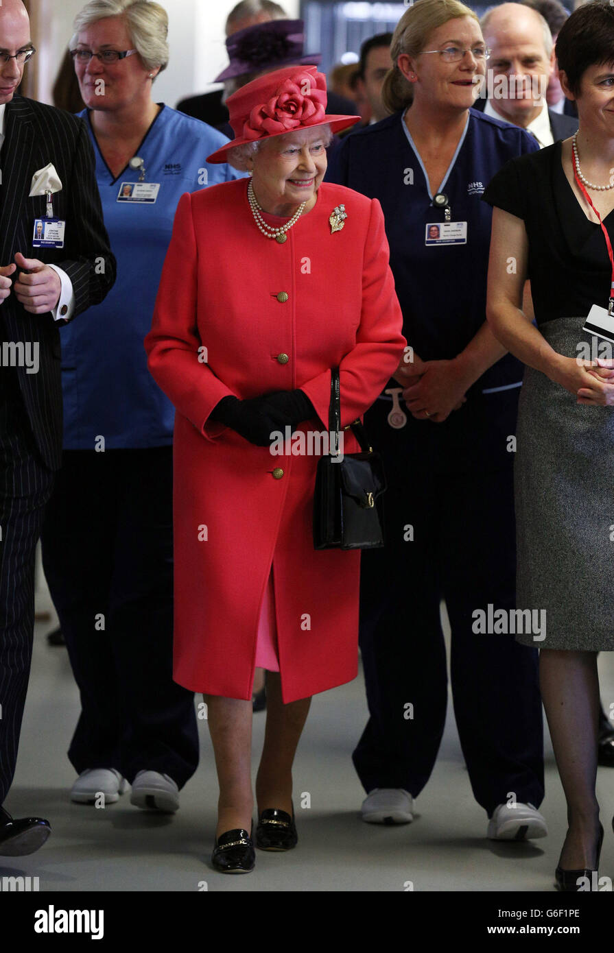 Queen Elizabeth II talks to patients as she officially opens an ...