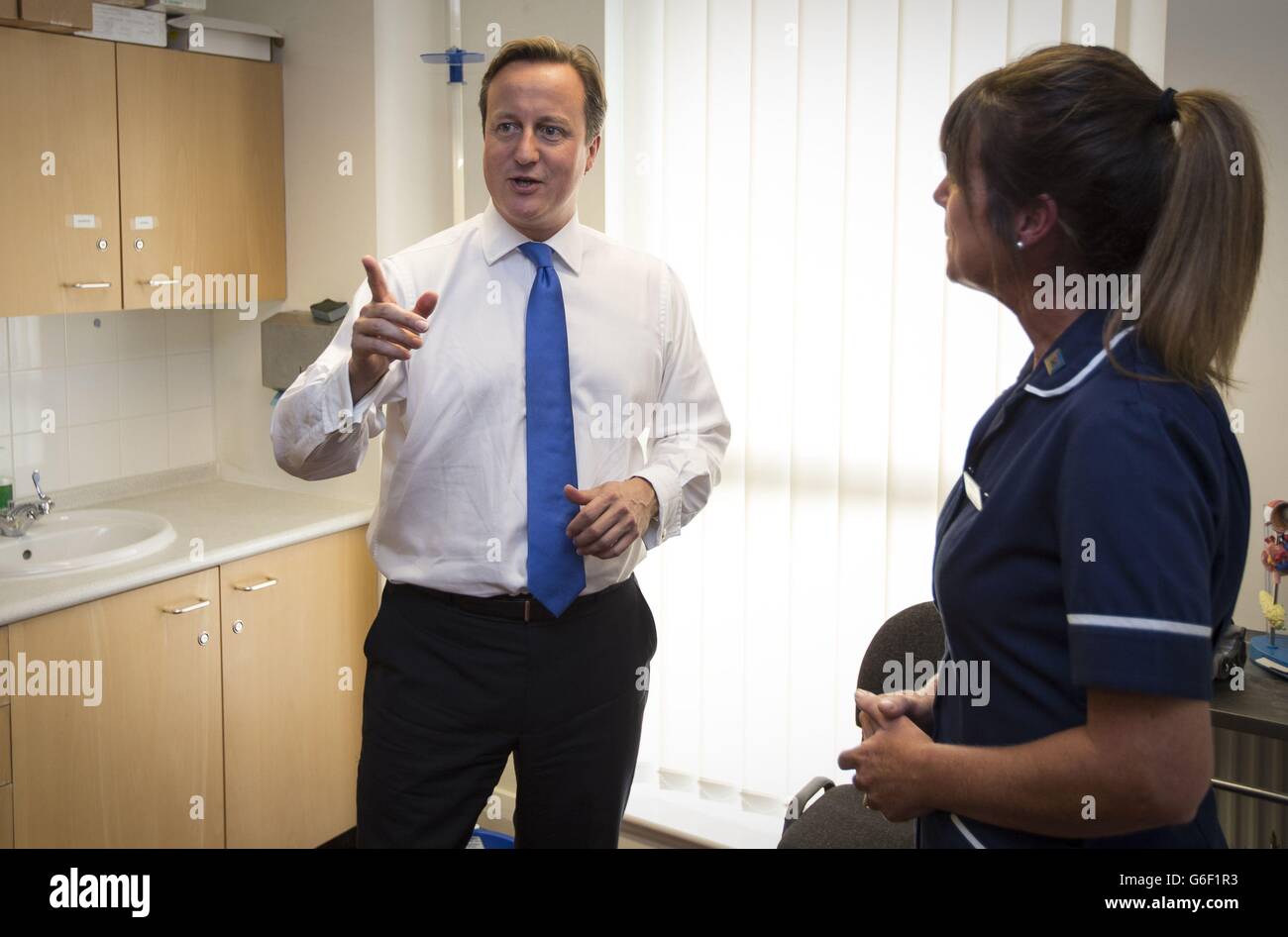 Prime Minister David Cameron while talking with Sister Julie Lees ...