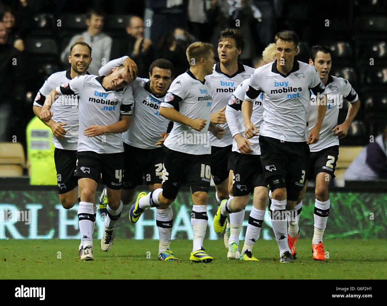 Derby County's Craig Bryson (second left) celebrates scoring his sides ...