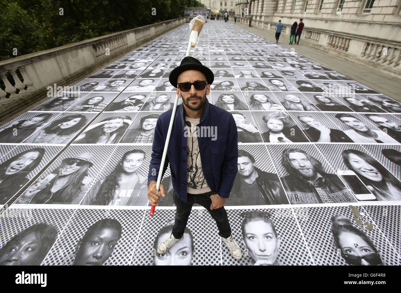 French artist JR pictured with his public art installation at Somerset ...