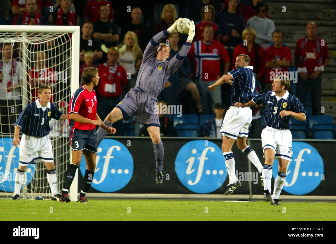 Scotland keeper Robert Douglas saves successfully an attack on goal ...
