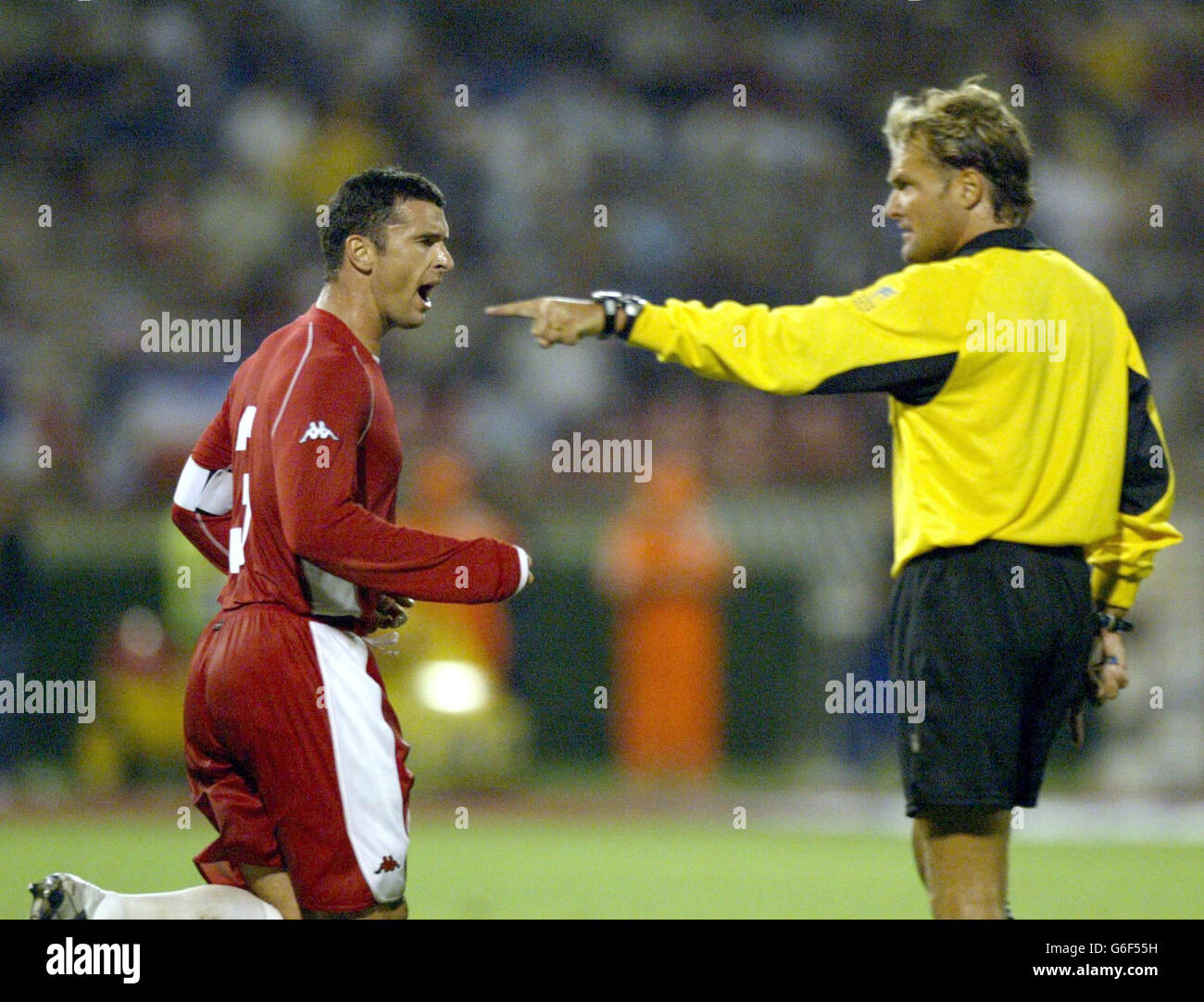 Wales' captain Gary Speed exchanges words with referee Anders Frisk ...