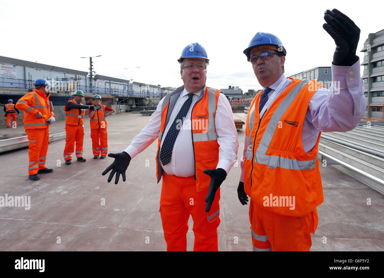 The Secretary of State for Transport Patrick McLoughlin (2nd right ...
