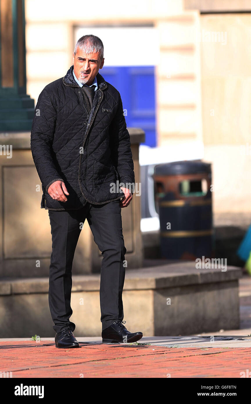 Aftab Khan (right) arriving at Bradford Crown Court where he is due to ...