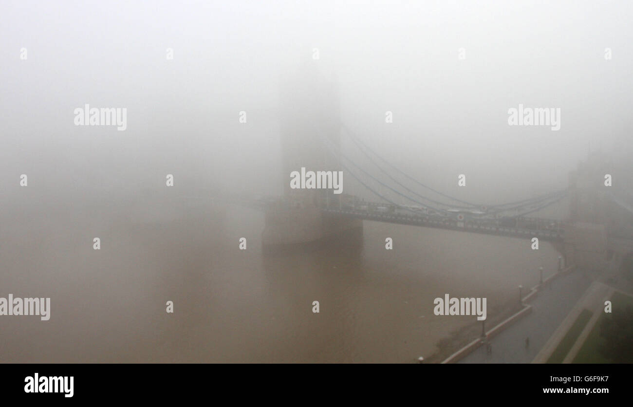 A general view of Tower Bridge in fog in central London Stock Photo - Alamy