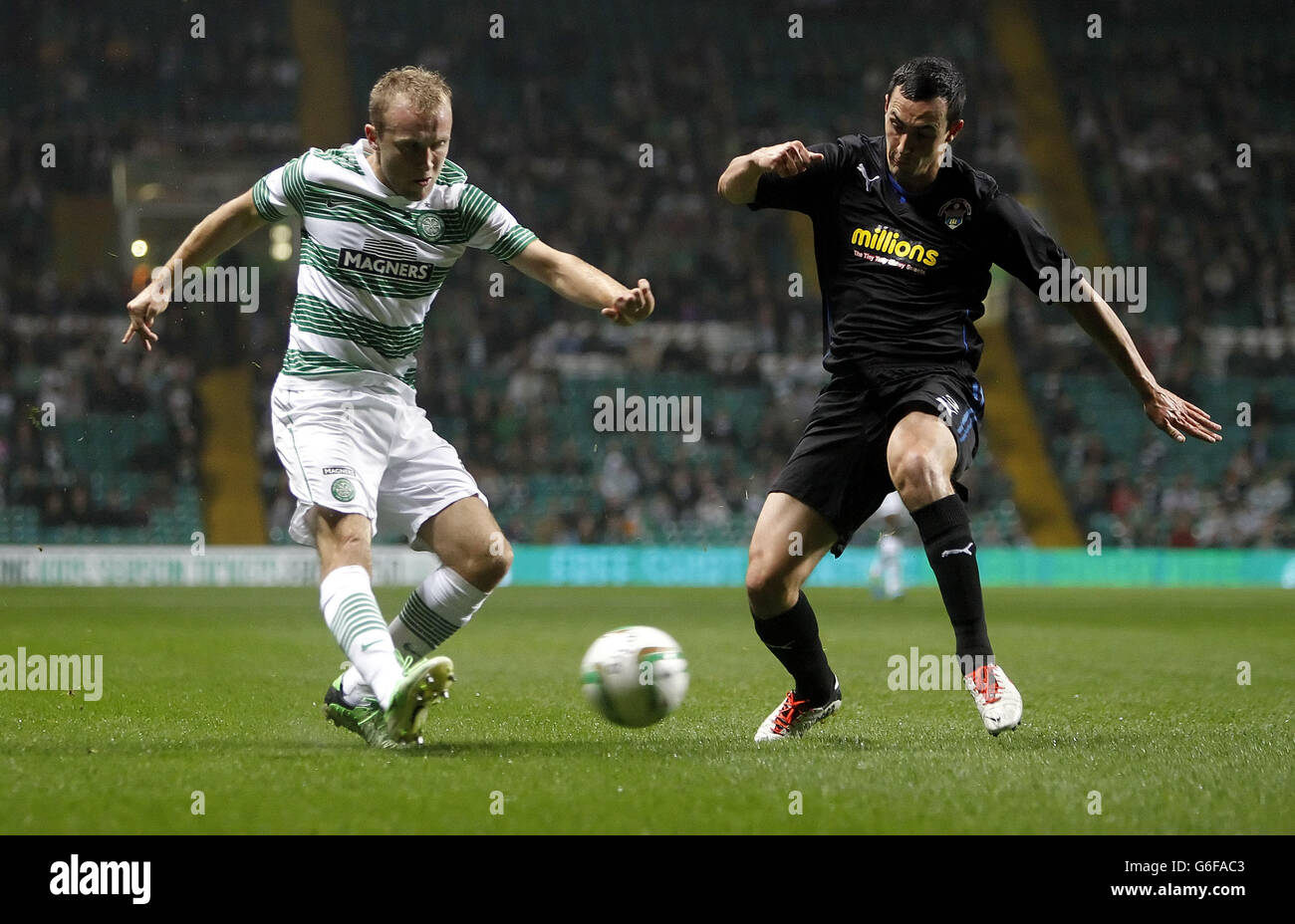 Celtic's Dylan McGeouch (left) and Morton's Marc Fitzpatrick fight for ...