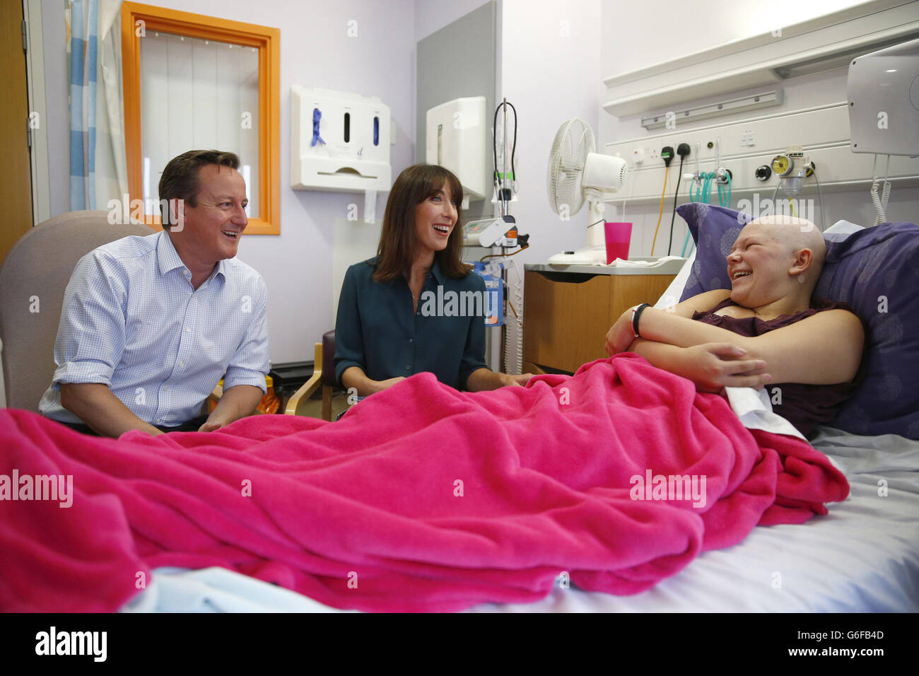 Prime Minister David Cameron (left) and his wife Samantha talk to Chase ...