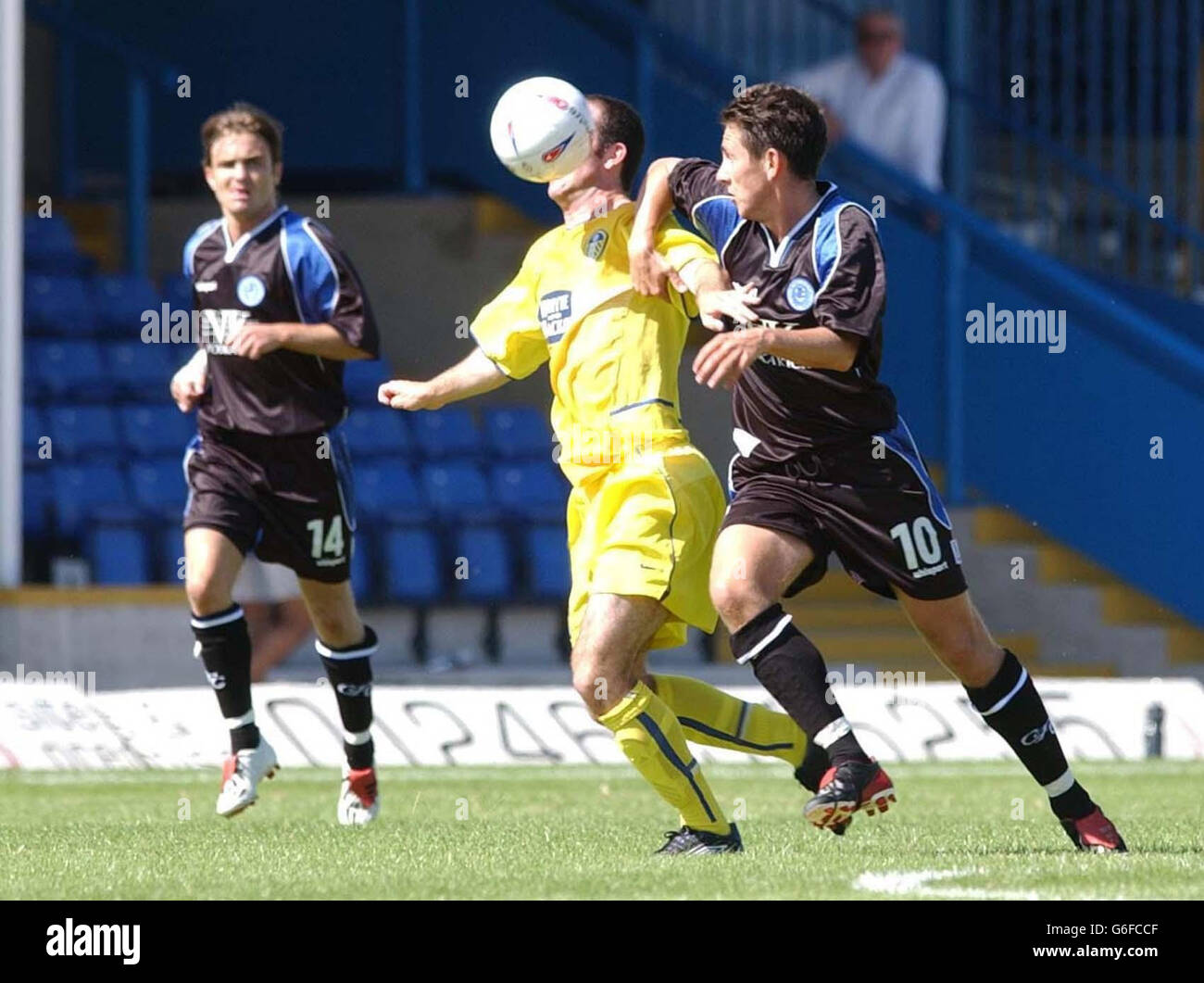 Chesterfield's Mark Hudson (R) challenges Leeds United's Paul Keegan ...