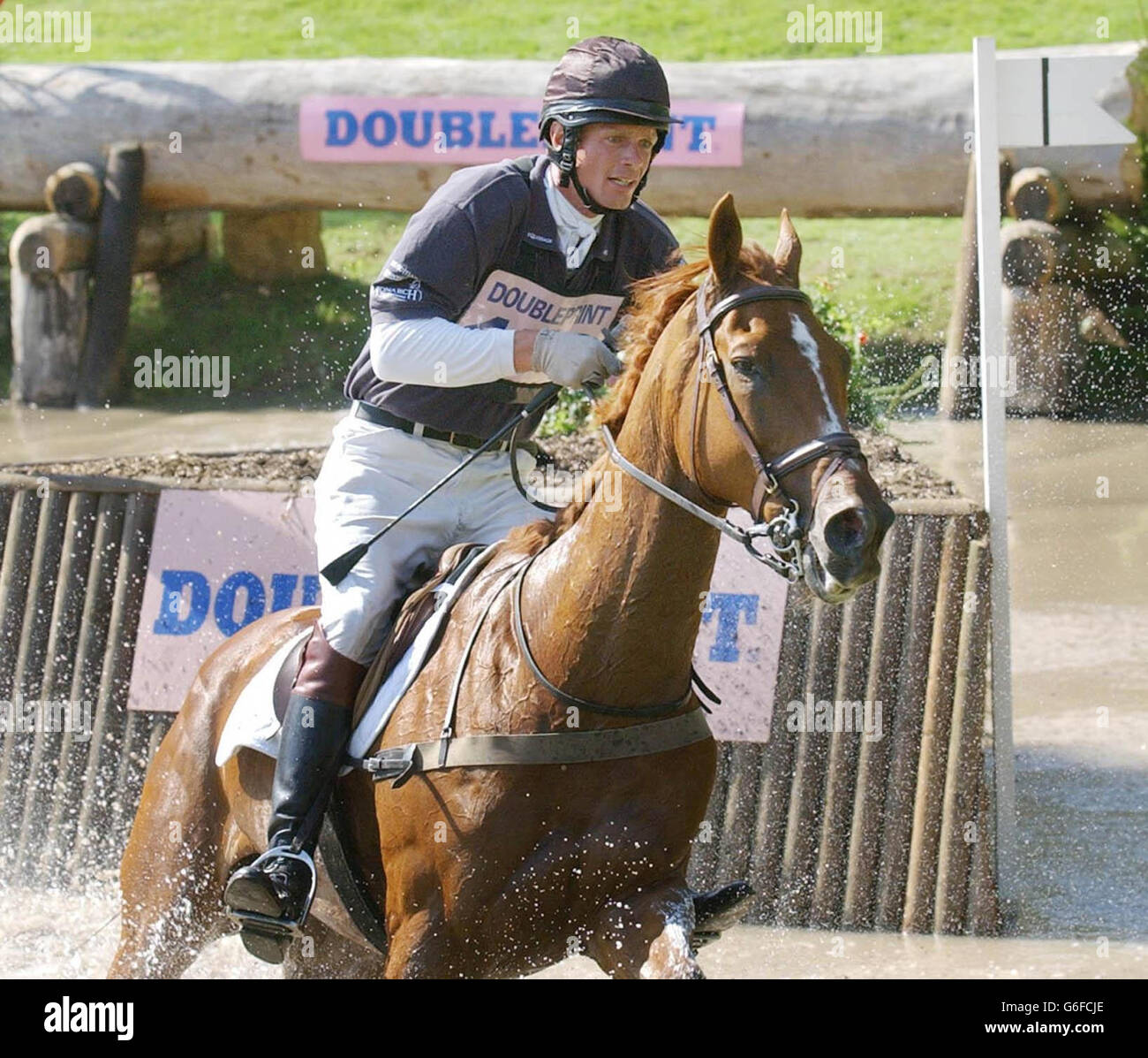 Stunning ridden by William Fox-Pitt go through the lake during the ...