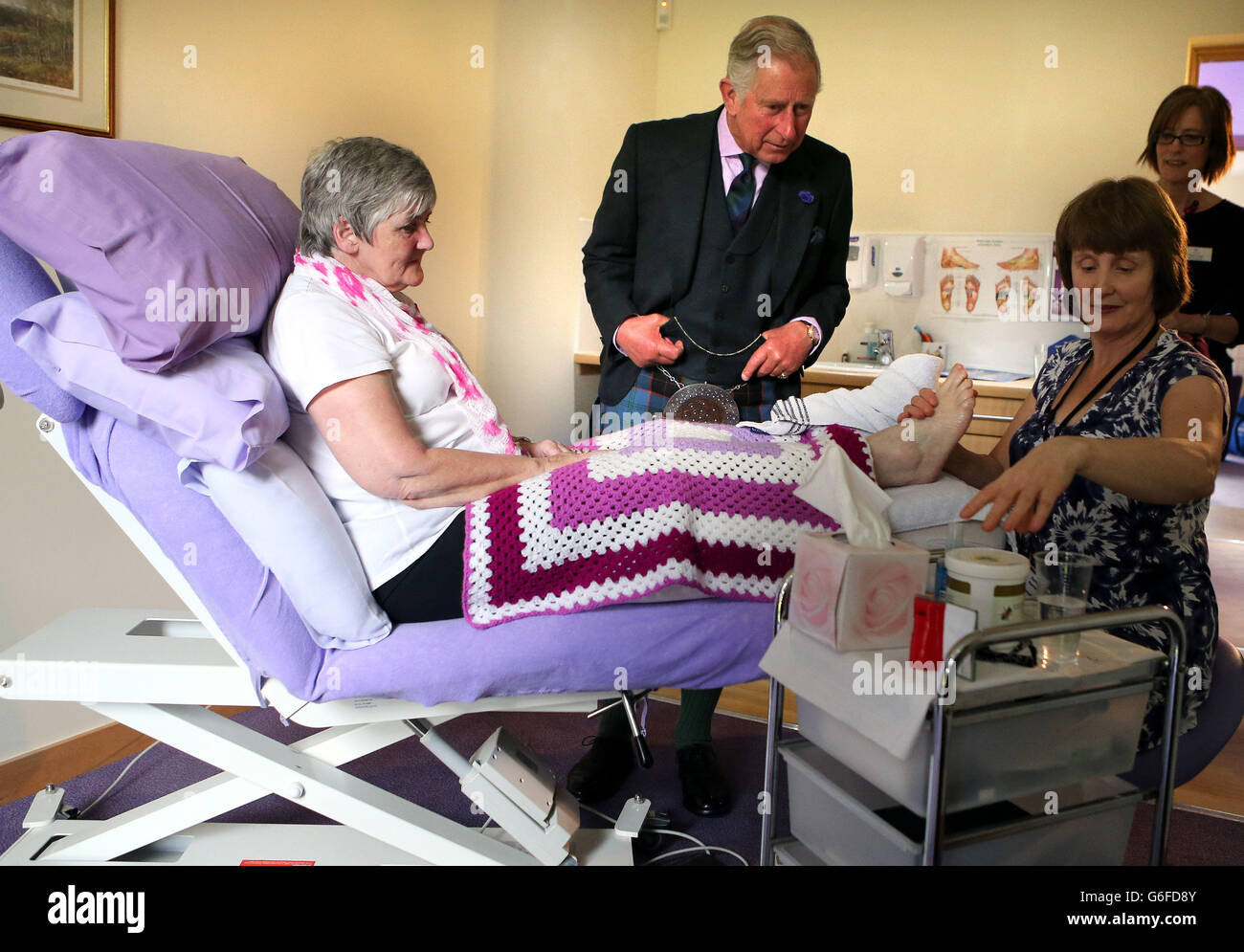 The Prince of Wales speaks with reflexologist Susan Hume and patient ...