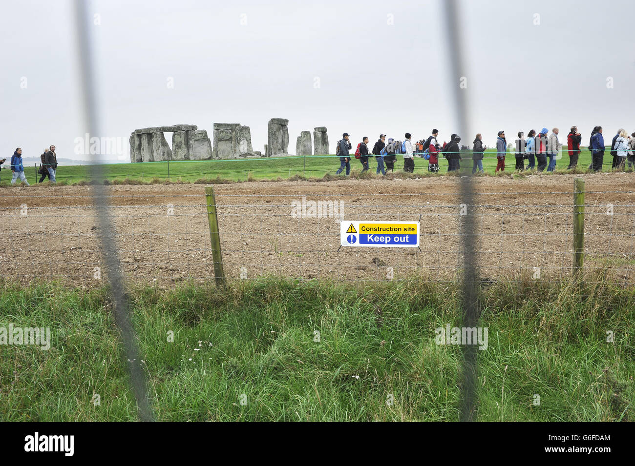 Visitors walk past the now covered road at Stonehenge Stock Photo - Alamy