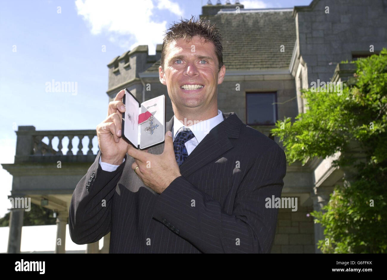 Former international soccer striker Niall Quinn poses for photos after ...