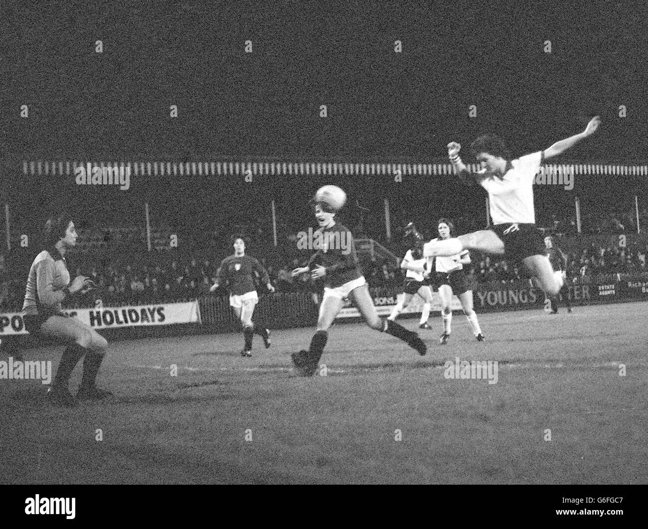 England Striker Debbie Day in fine form as she leaps in to a scissors ...