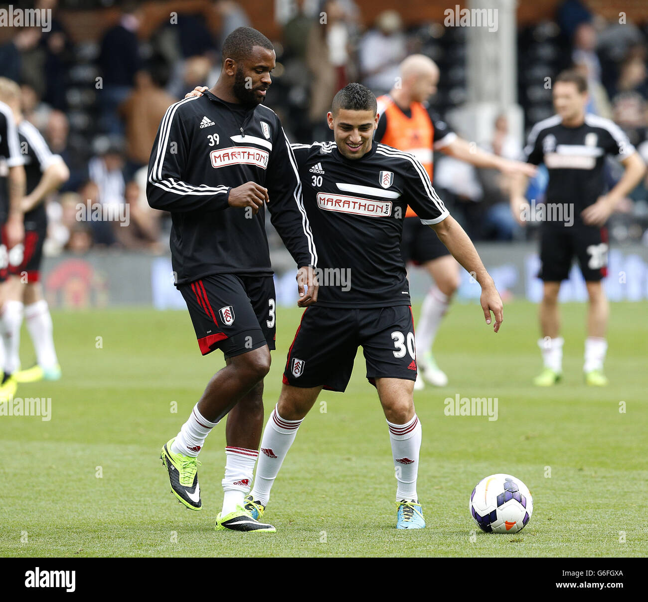 Fulhams bent left chris david share joke during warm up hi-res stock ...