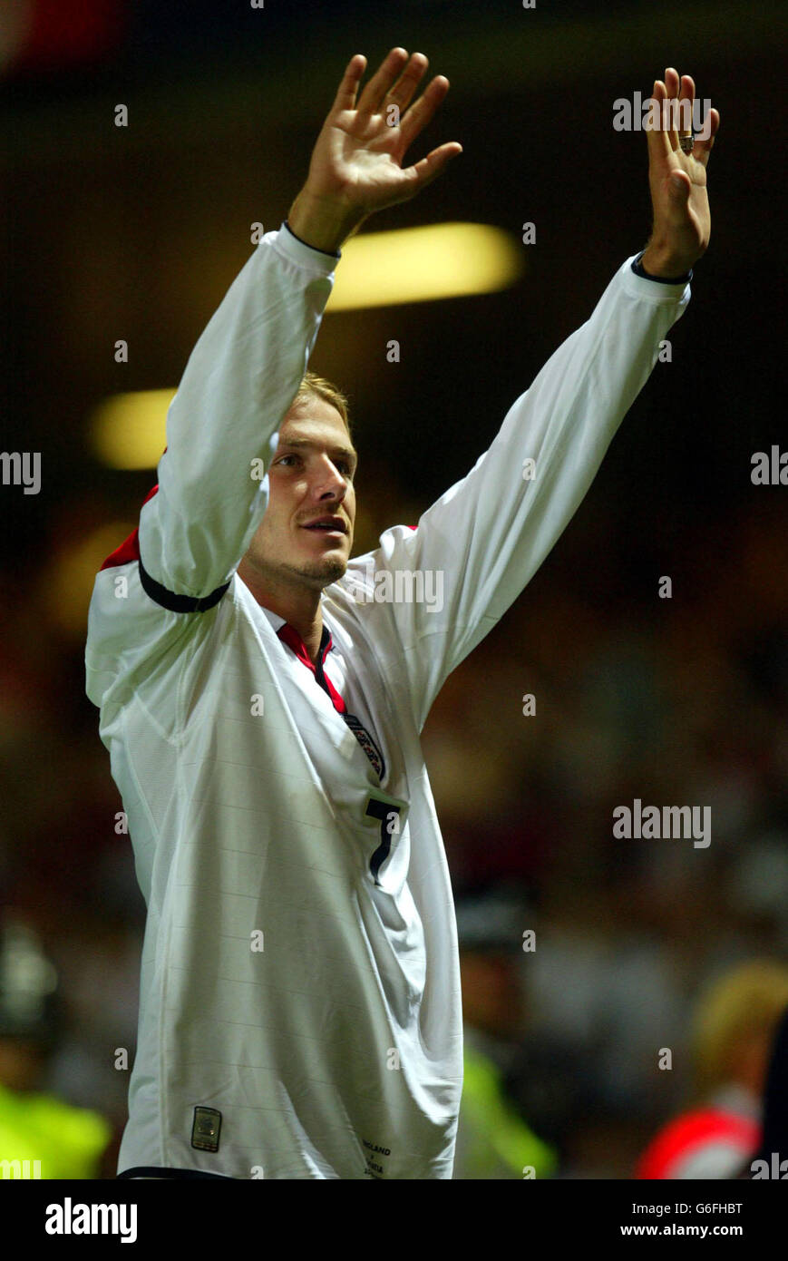 England Captain David Beckham waves to the crowd as he leaves the pitch ...