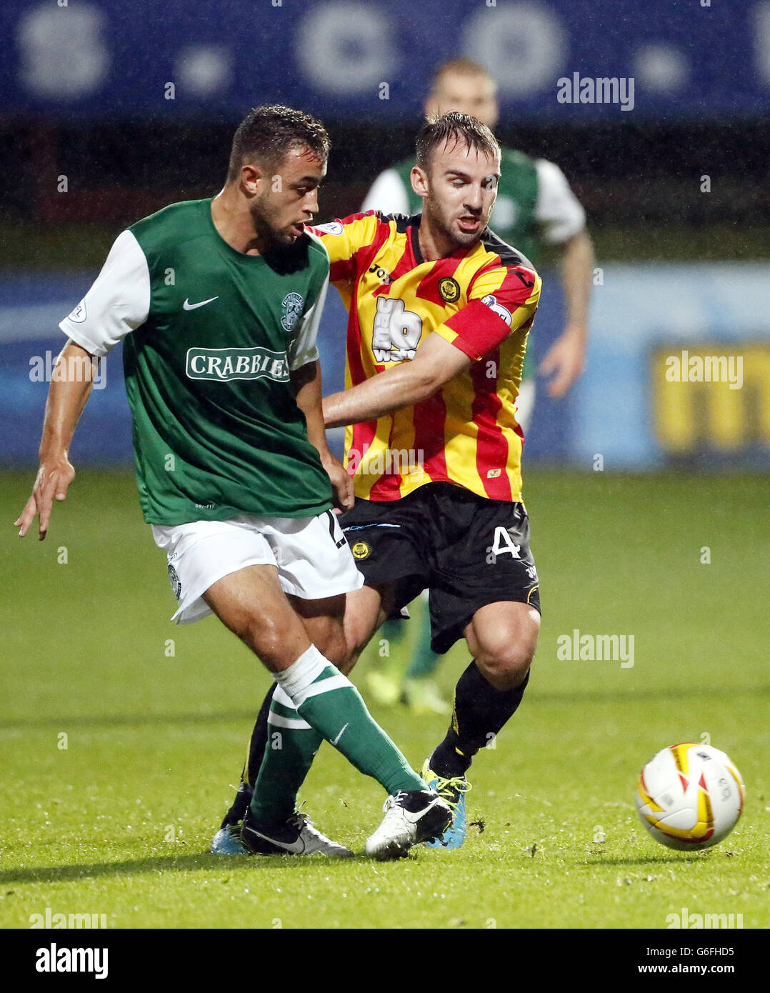 Hibernian's Tom Taiwo and Partick's Thistle's Sean Welsh battle for the ...