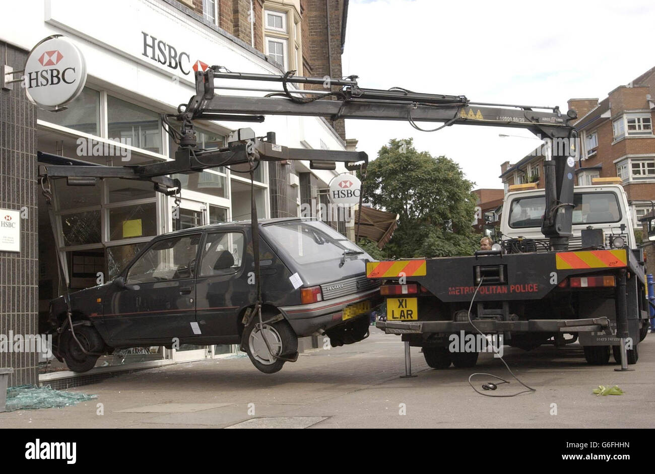 Police remove a car from the HSBC bank in Southgate, north London ...