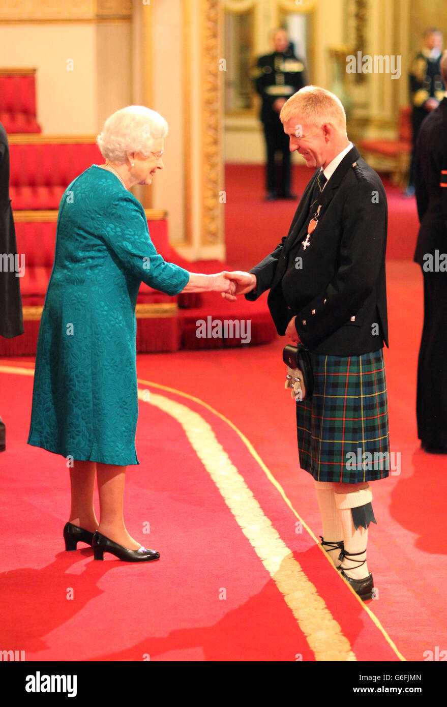 Donald MacLeod receives an MBE from Queen Elizabeth II at an ...