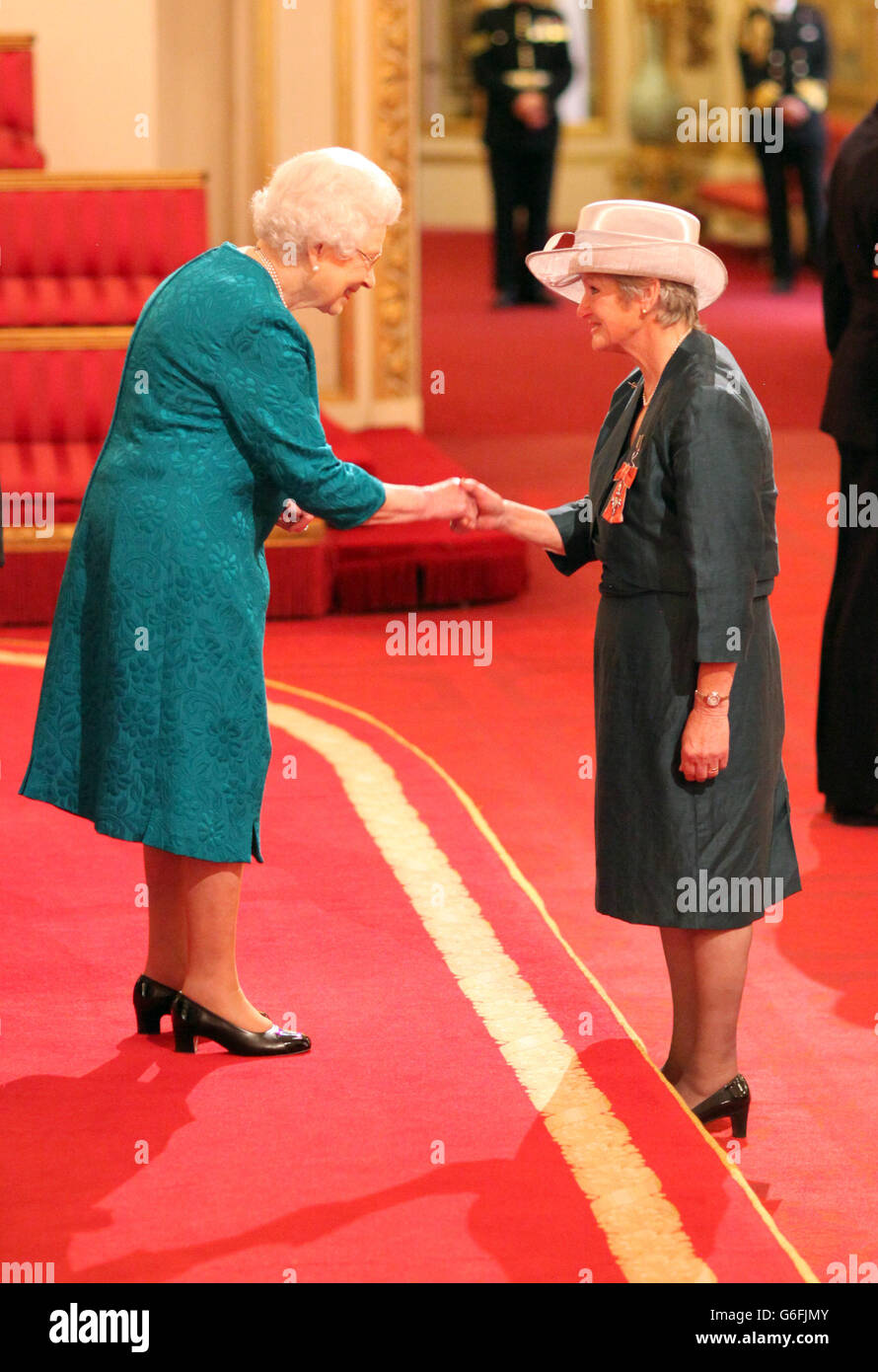 Caroline Dale-Leech receives an MBE from Queen Elizabeth II at an ...