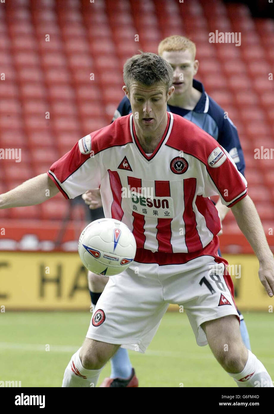 Sheffield United's Michael Tonge shields the ball from Coventry's ...
