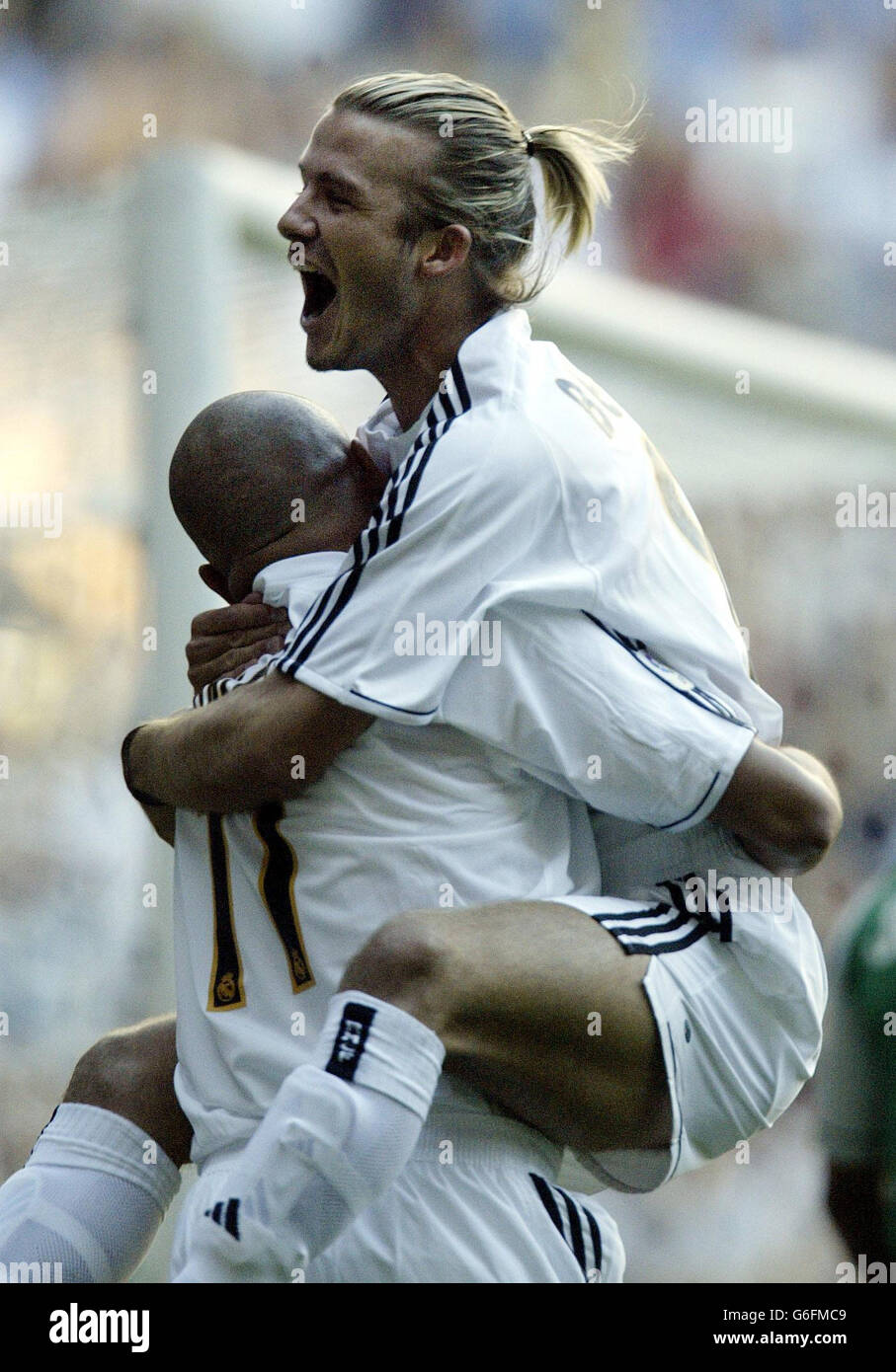 Real Madrid's David Beckham (right) celebrates with teammate Ronaldo ...
