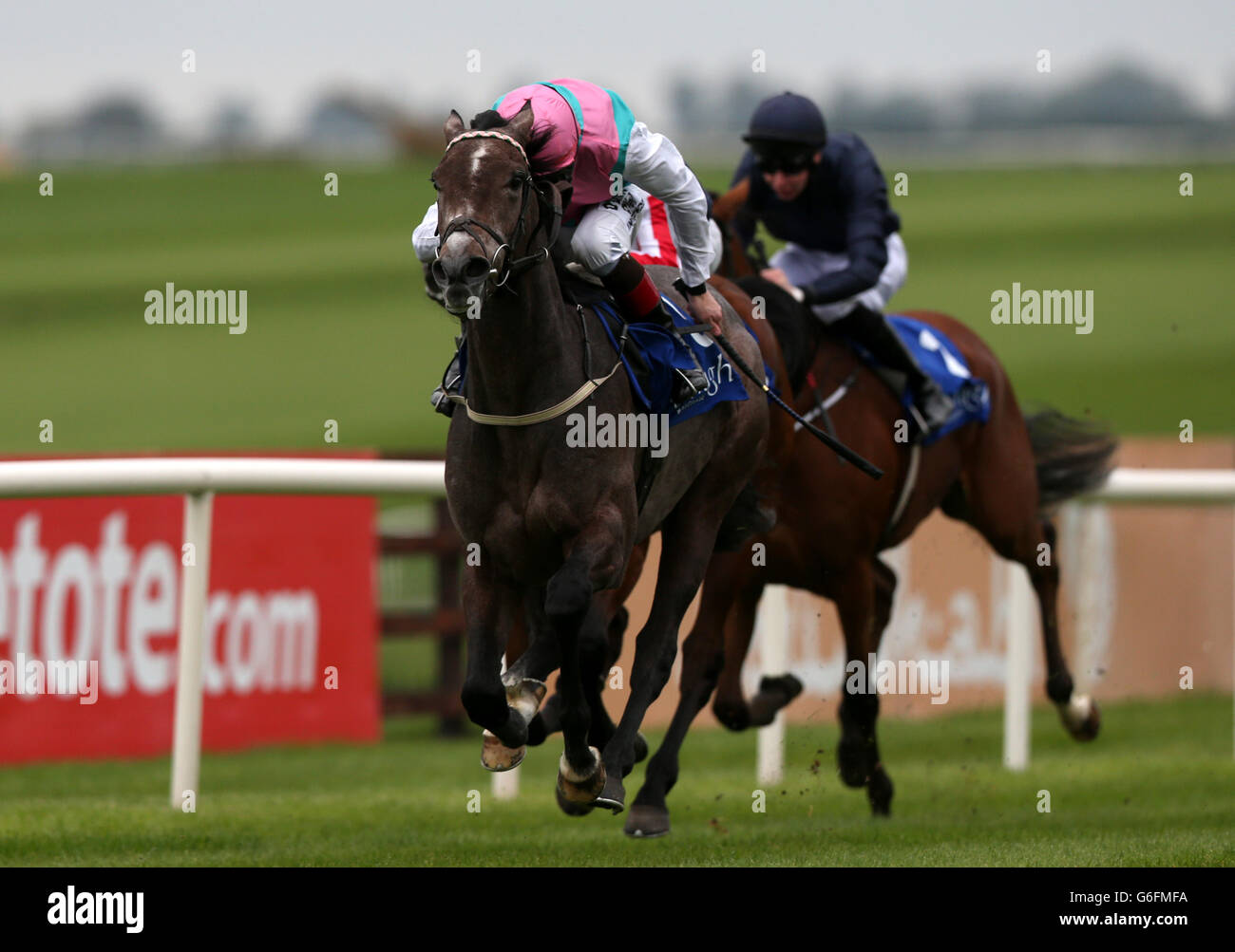 Flying Jib ridden by Pat Smullen (left) races clear of third place ...
