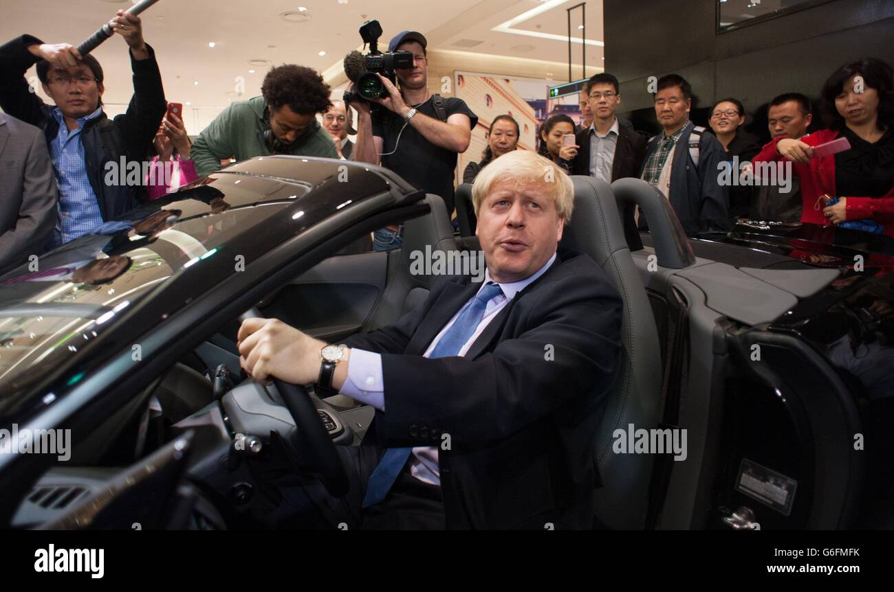 Mayor of London Boris Johnson sits in a Jaguar sports car as he tours ...