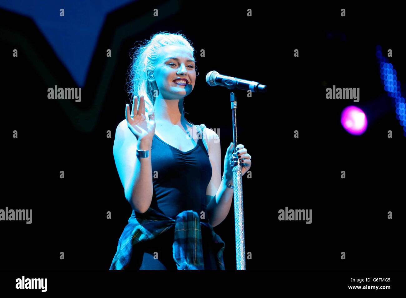 Little Mix's Perrie Edwards performing at Girlguiding UK's Big Gig 2013 ...