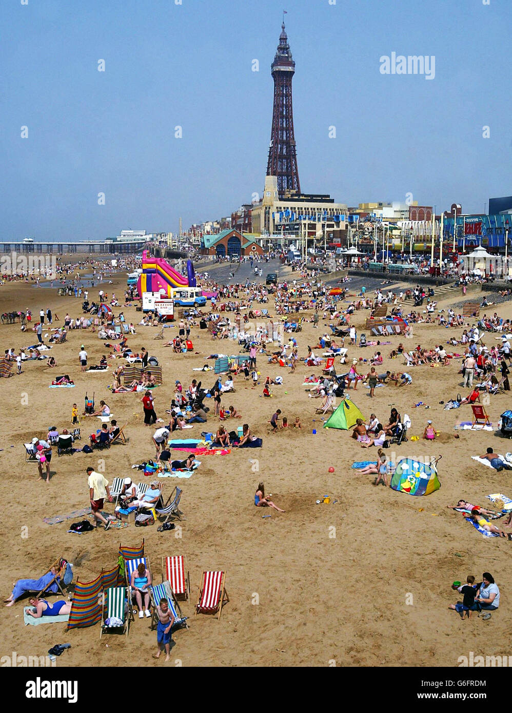 Holiday makers in Blackpool enjoy the beach. Britain's heatwave could ...