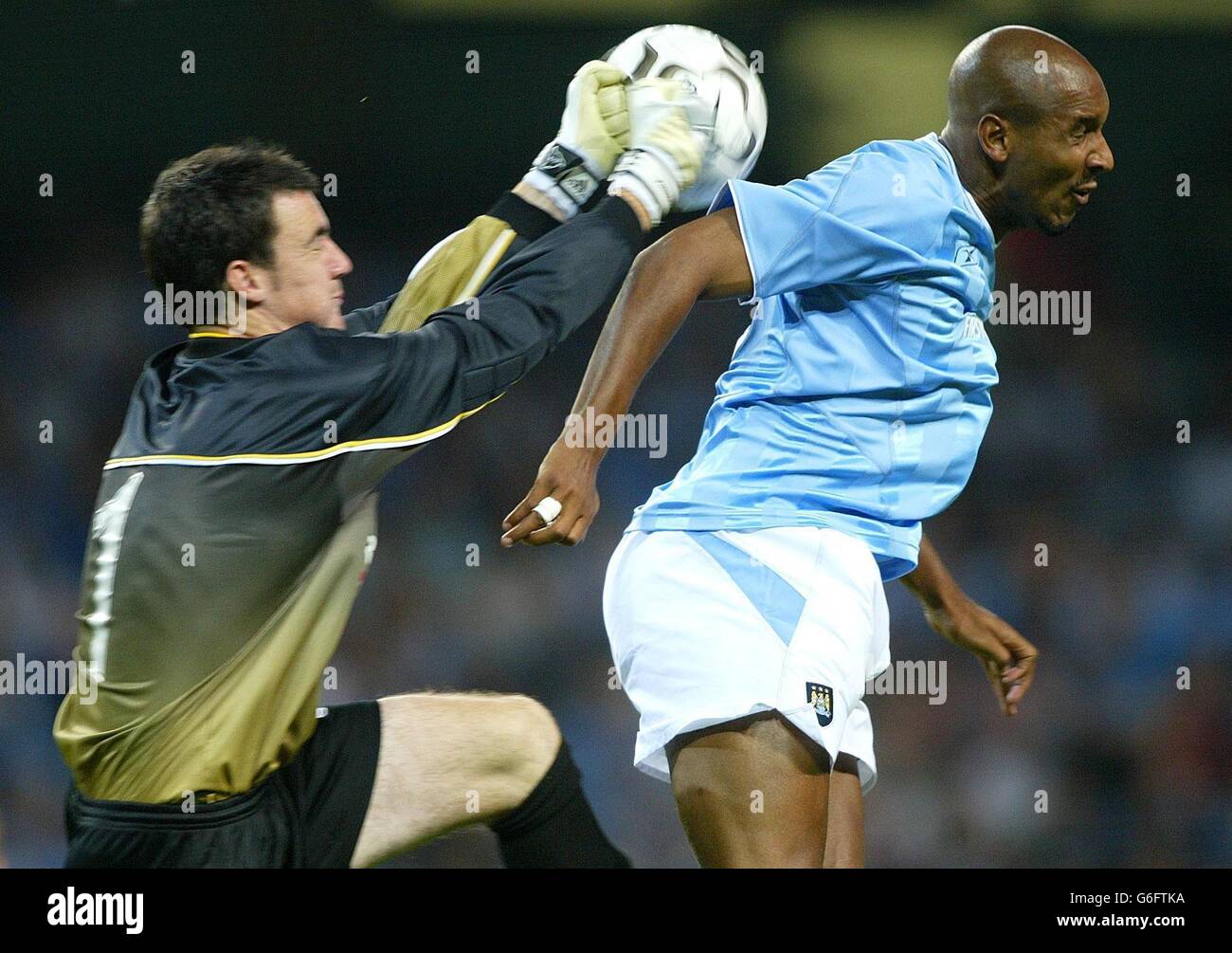 TNS goalkeeper Gerard Doherty punches clear from an attempt by ...